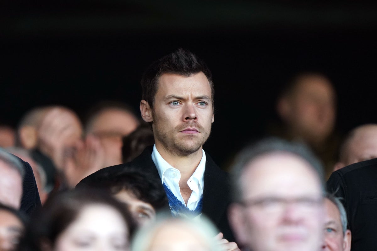 Harry Styles debuts new haircut as he cheers on Luton Town from the stands