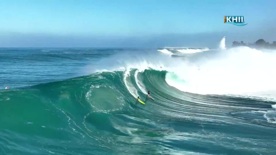 Surfers charge, catch epic waves in The Eddie