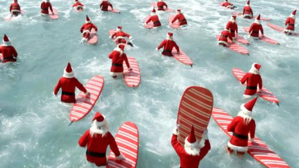 SantaCon South? Hundreds of Red-Suited Santas Will Surf the Atlantic in ...