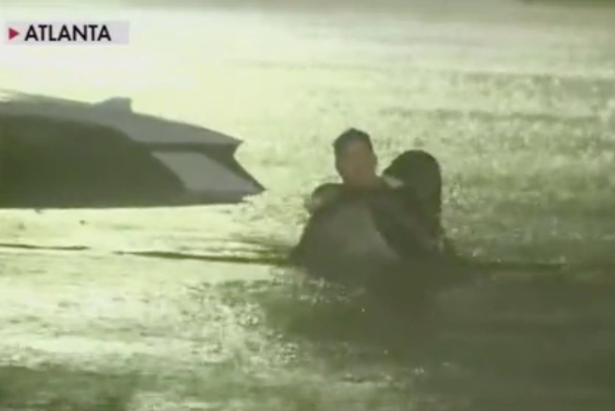TV reporter interrupts live broadcast to rescue trapped woman during ...