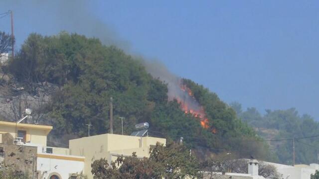Wildfires burn through Greece's popular vacation island Rhodes