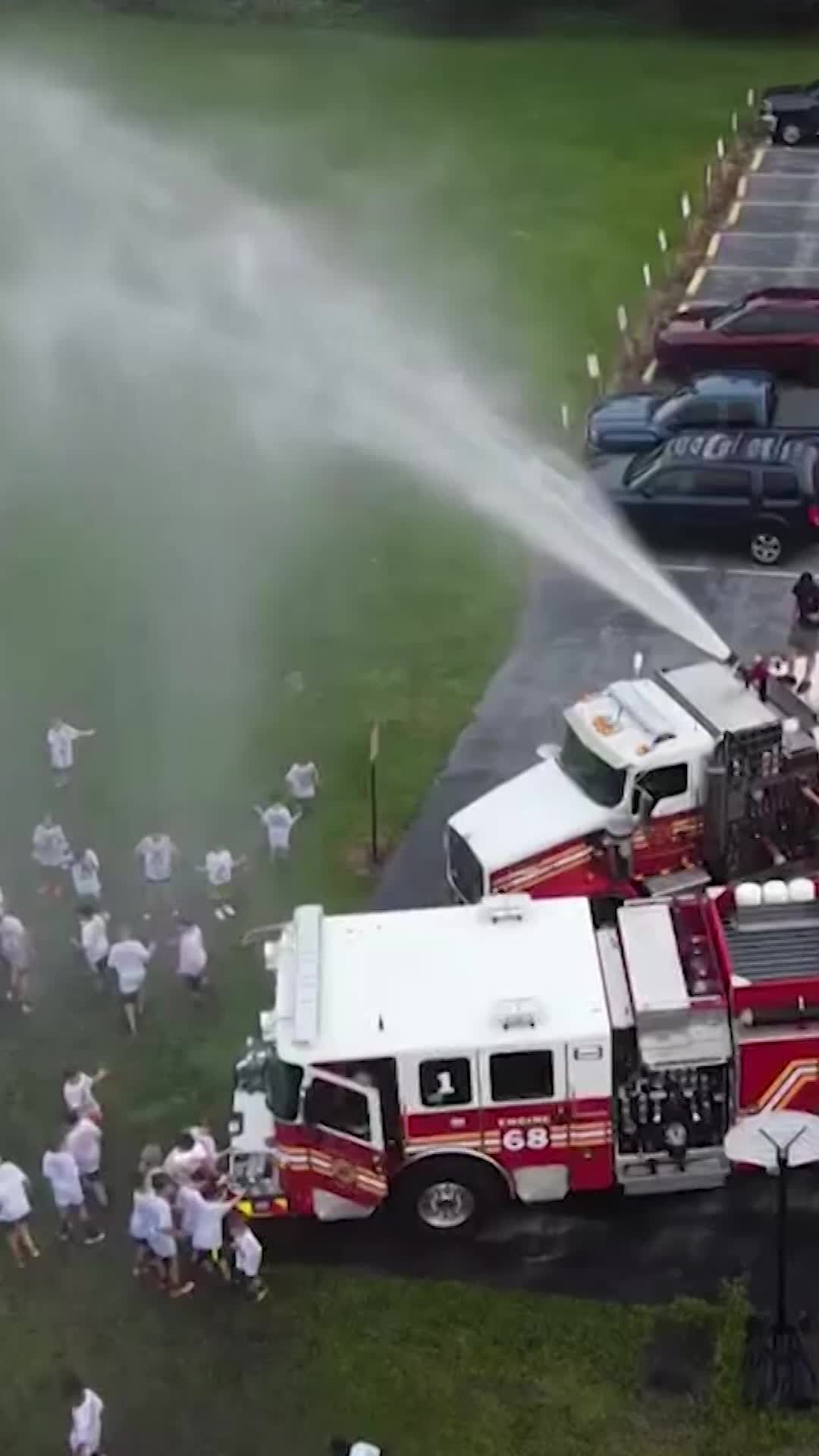 Firefighters help football players cool off