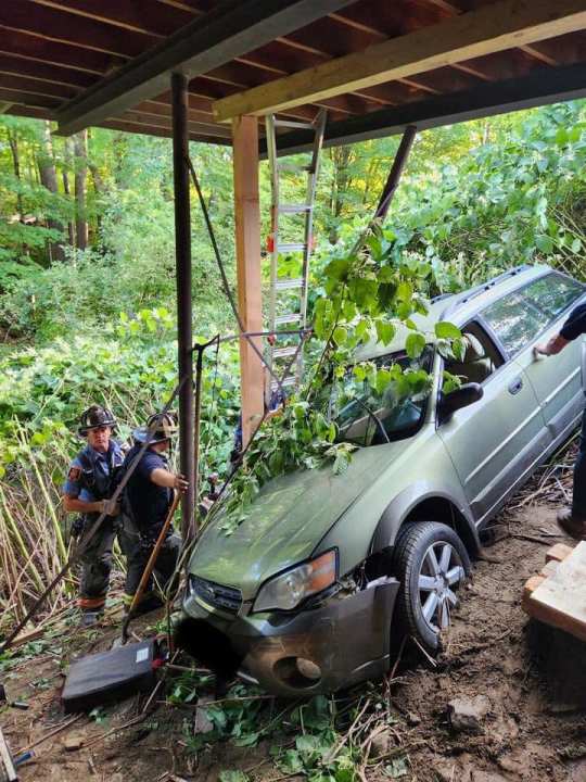 PHOTOS: 2 hospitalized after a car drove into a house in Bantam